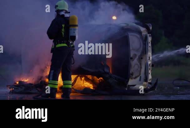 Firefighters fight the fire flame to control fire not to spreading out ...