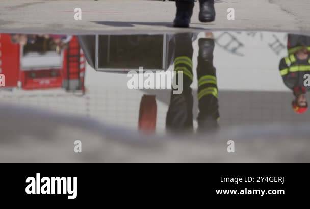 reflective scene captures a firefighter heading into a dangerous ...