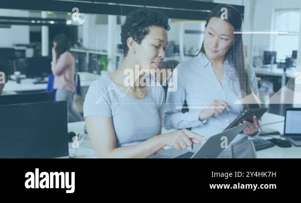 Discussing data on tablet, businesswomen with financial chart animation ...