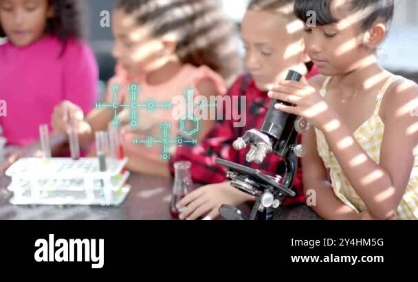 Chemical formulas over children conducting science experiments in classroom. education ...