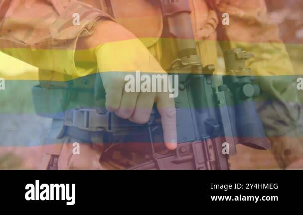 Rainbow flag animation over soldier holding rifle in outdoor setting ...