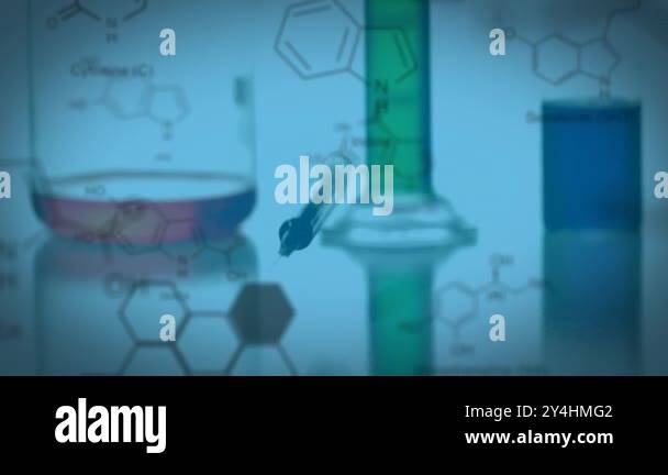 Syringe and laboratory glassware with chemical formulas, scientific ...