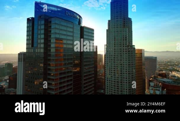 Rising to the top of the huge building of Deloitte Company in LA with ...