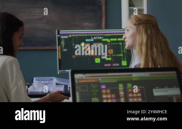 Back view waist up shot of two multiethnic gen z female students ...