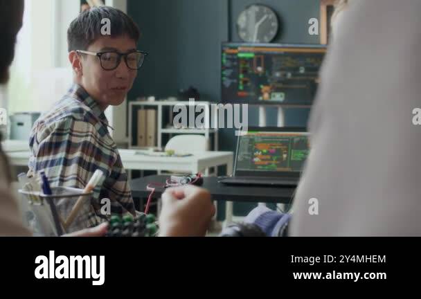 Multiethnic group of gen z boys and girls having programming and ...