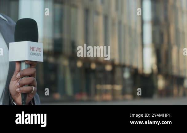 Cropped shot of unrecognizable African American female news channel ...