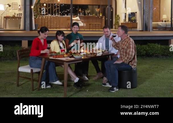 Family together for holiday celebration in garden. Family member gather ...