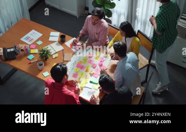 Close up of professional business team hands writing and putting sticky ...