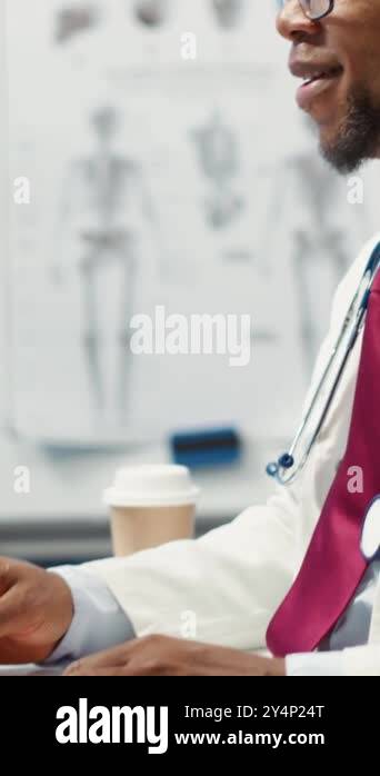 Vertical Video Doctor and patient discussing diagnostic results in a ...