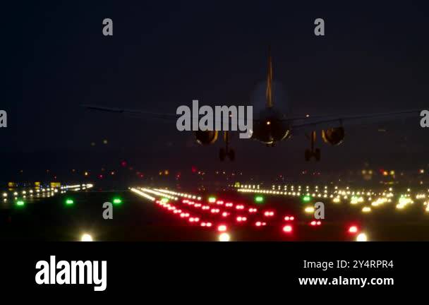 Passenger airplane landing at night showcases a vibrant scene with ...