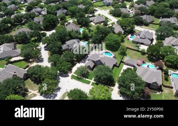 Upscale suburban house with inground swimming pools, grassy lawn, large ...