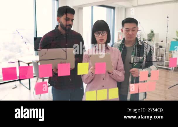 Group of young professionals in collaborative brainstorming session ...