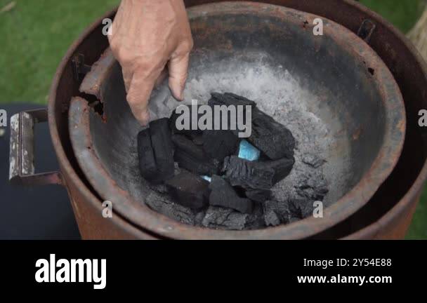 Start charcoal fire Stock Videos & Footage - HD and 4K Video Clips - Alamy