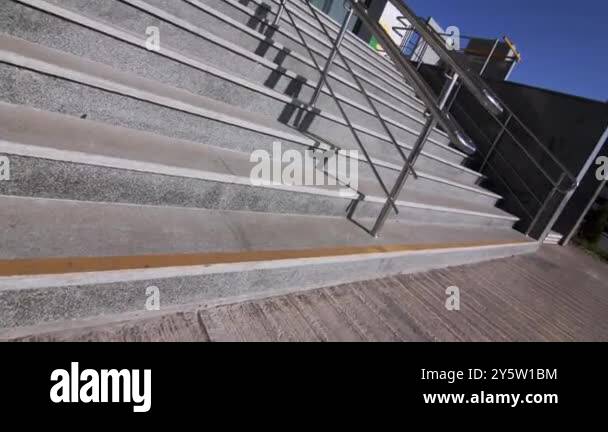 Granite steps with shiny chrome handrails at school building entrance ...