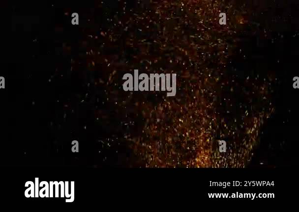 Realistic floating embers particles on black screen background.You can ...