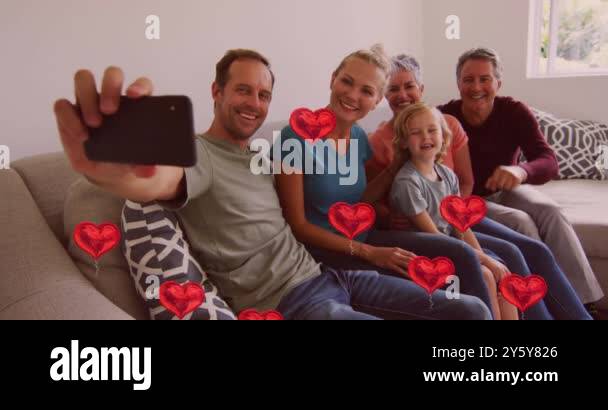 Taking selfie, family sitting on couch with floating red heart animations. togetherness, love ...