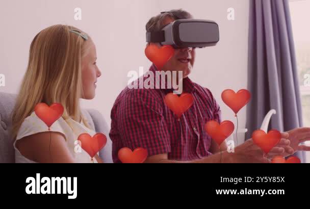 Wearing VR headset, man interacting with virtual world over heart ...