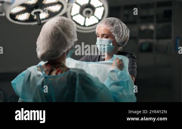 in modern clinic in a bright spacious operating room, the doctor, the ...