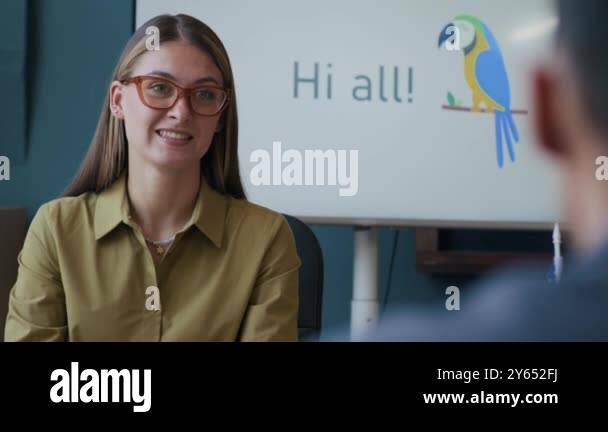 Chest up of Caucasian female teacher speaking to multiracial student ...