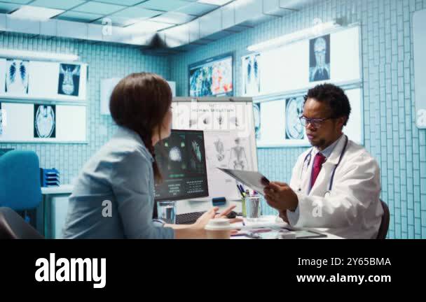 Female patient listening to a diagnostic report from doctor based on ...