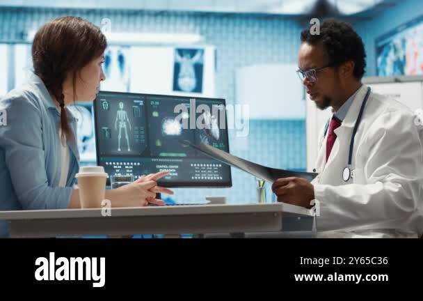 Female patient listening to a diagnostic report from doctor based on ...