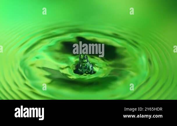 Slow motion of splashing water drop on green screen background , filmed ...