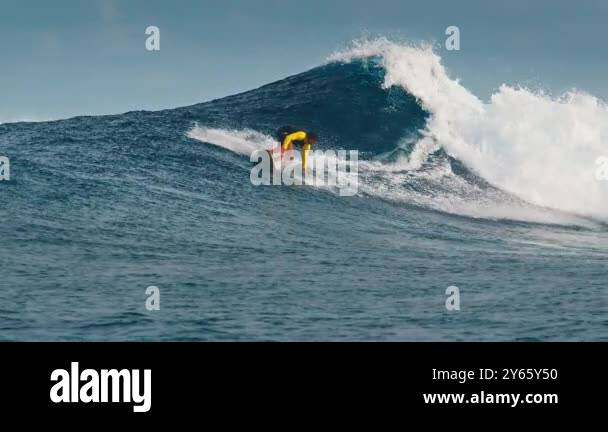 Experienced surfer rides the ocean wave at the famous Sultans surf spot ...
