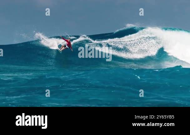 Experienced surfer rides the ocean wave at the famous Sultans surf spot ...
