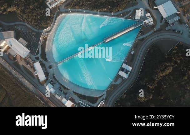 Surfing pool. Top down aerial view of the pool with artificial waves ...