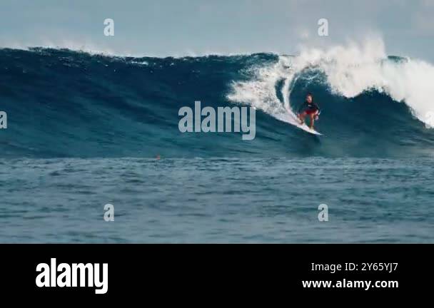 Experienced surfer rides the ocean wave at the famous Sultans surf spot ...