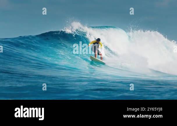 Experienced surfer rides the ocean wave at the famous Sultans surf spot ...