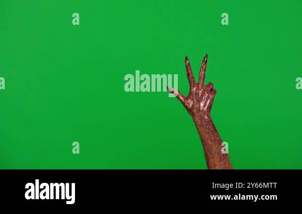 Scary hand showing gestures in studio. Creepy halloween monster hand in ...