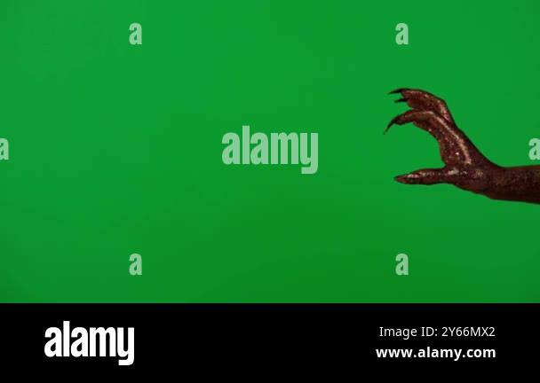 Scary hand showing gestures in studio. Creepy halloween monster hand in ...