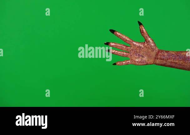 Scary hand showing gestures in studio. Creepy halloween monster hand in ...