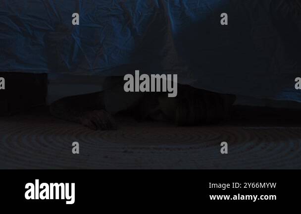 Young female napping at home in darkness. Woman sleeping in bed in ...