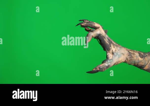 Scary hand showing gestures in studio. Creepy halloween monster hand in ...