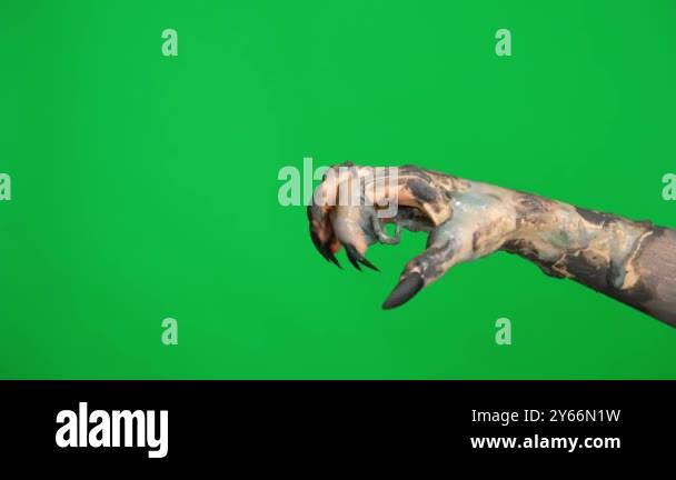 Scary hand showing gestures in studio. Creepy halloween monster hand in ...