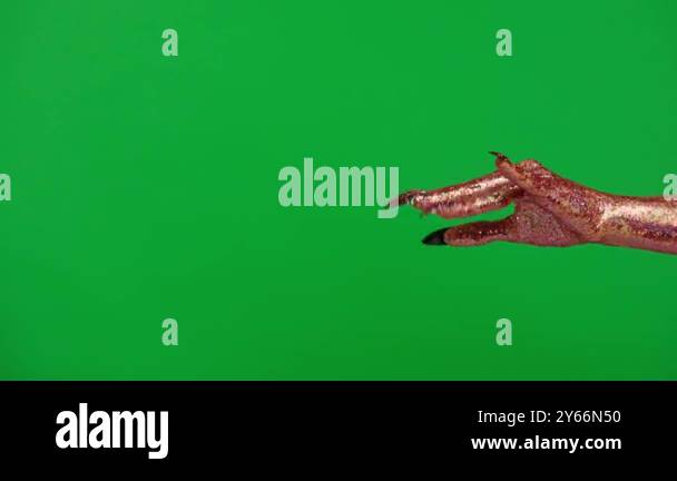 Scary hand showing gestures in studio. Creepy halloween monster hand in ...