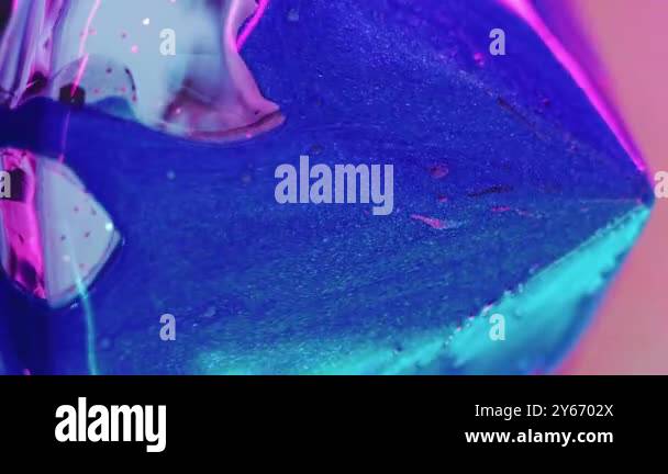 Vertical video. Glitter gem. Shiny paint spill. Defocused neon light ...