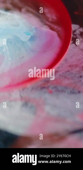 Vertical video. Paint water splash. Color mist. Blur red blue white ...