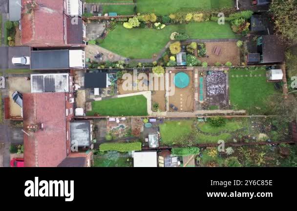 Aerial footage of a typical British housing estate showing the roofs ...