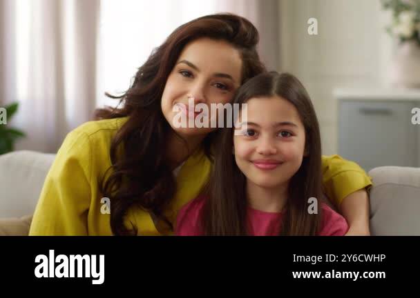 Happy loving Caucasian family portrait. Smiling woman female mom parent mother hugging little ...