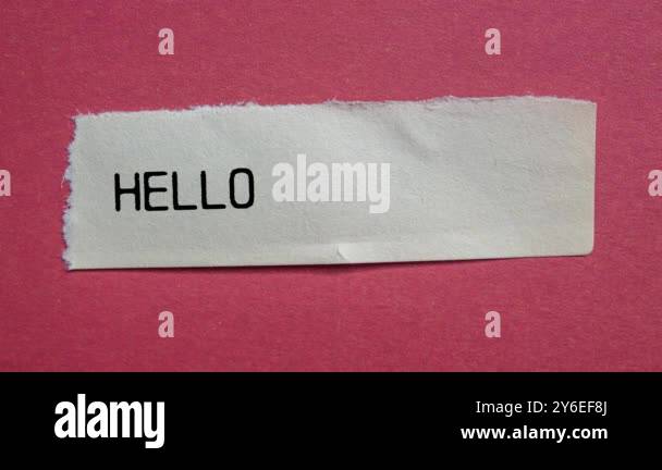 Hello and welcome message writing on ripped torn paper piece on red ...