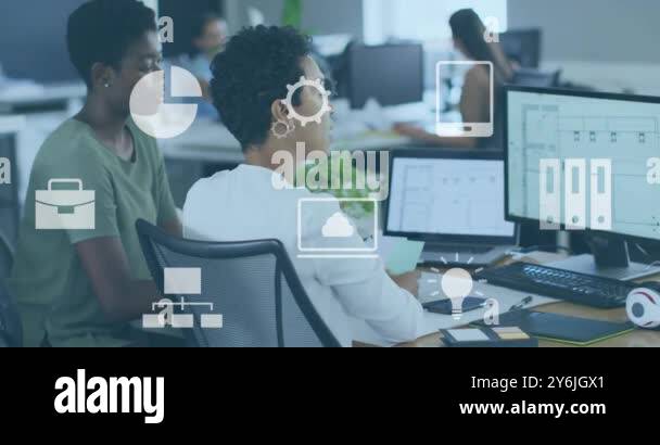 Business icons animation over diverse professionals working on ...