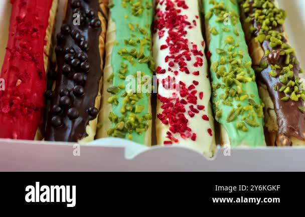 Assorted wafer rolls close-up.Wafer rolls with dried raspberries ...
