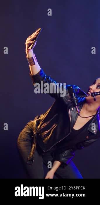 Vertical video Rocker singer chatting on a video call and showing the ...