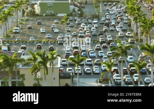Large parking lot with many parked cars. Big carpark at supercenter ...