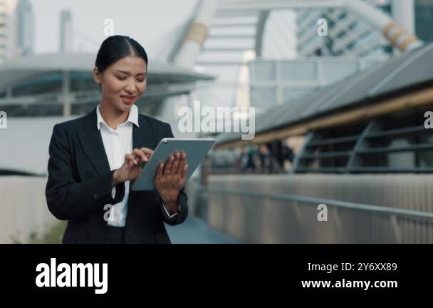 Busy Asian Lady Outside Walking, Holding Tablet and Working, Swiping ...