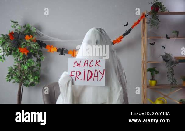 Person dressed as ghost posing at camera. Funny halloween ghost in ...