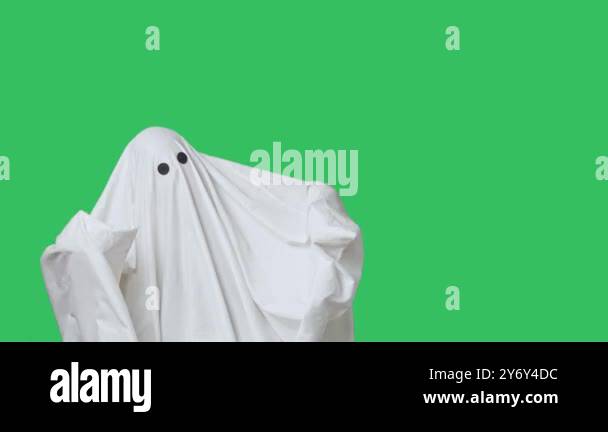 Person dressed as ghost posing at camera. Funny halloween ghost in ...